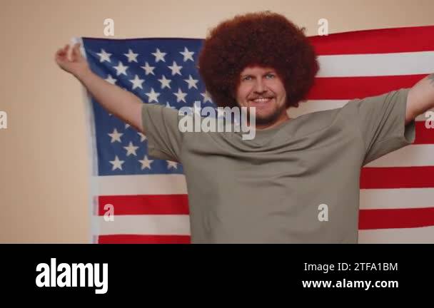 Handsome bearded man with lush hairstyle waving and wrapping in ...