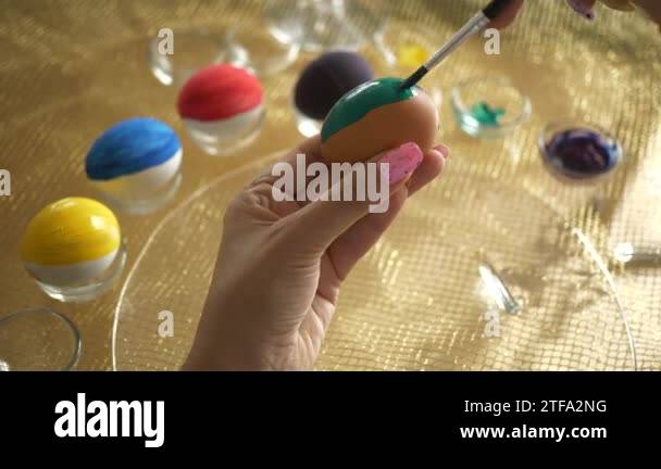 8K 7680x4320.Woman painting easter eggs.Cultural symbol of easter ...