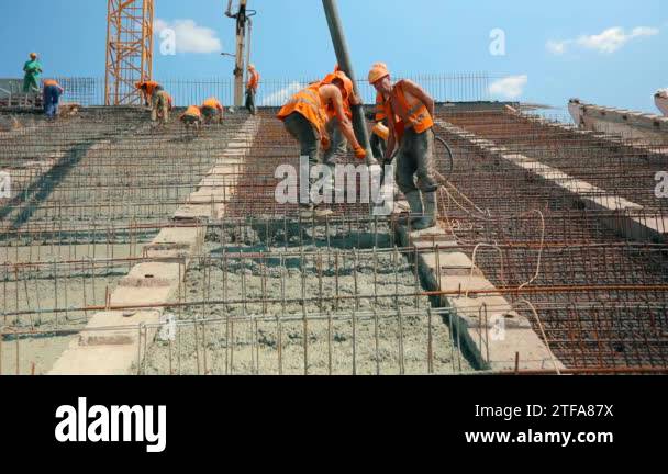 Building construction. Working process at a construction site. Builders ...