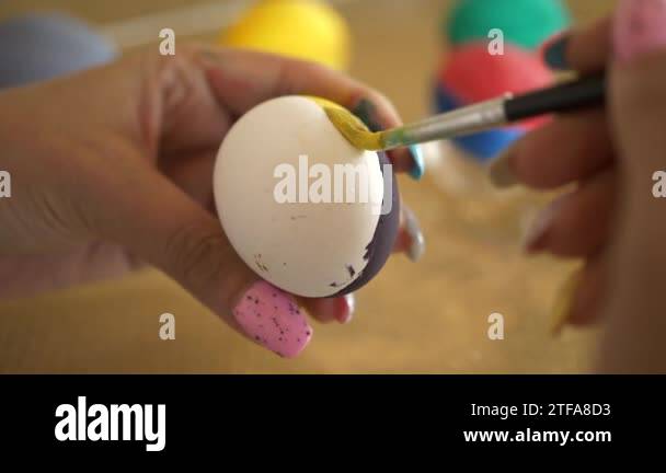 8K 7680x4320.Woman painting easter eggs.Cultural symbol of easter ...