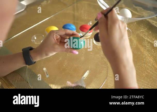 8K 7680x4320.Woman painting easter eggs.Cultural symbol of easter ...