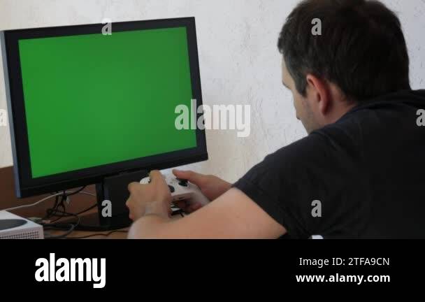 Young male gamer playing game console using joystick remote control ...