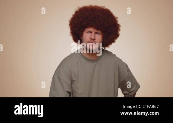 Quarrel. Displeased lush hairstyle man gesturing hands with irritation ...