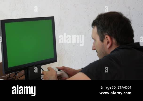 Young male gamer playing game console using joystick remote control ...