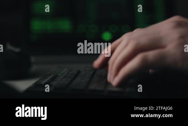 Hacker is typing keys on a keyboard in his room Stock Video Footage - Alamy
