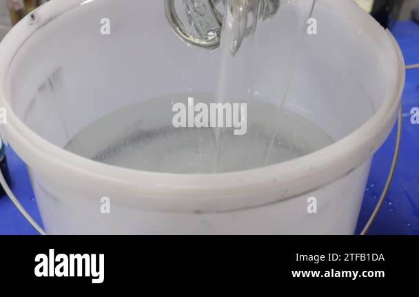 Mixing epoxy resin components with dye. One of the stages of ...