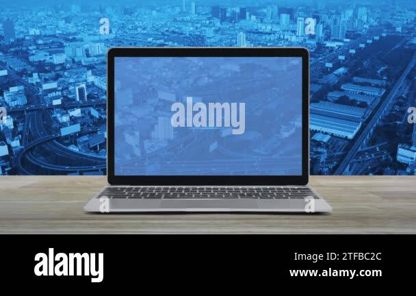 Bank flat icon on modern laptop computer monitor screen on wooden table ...