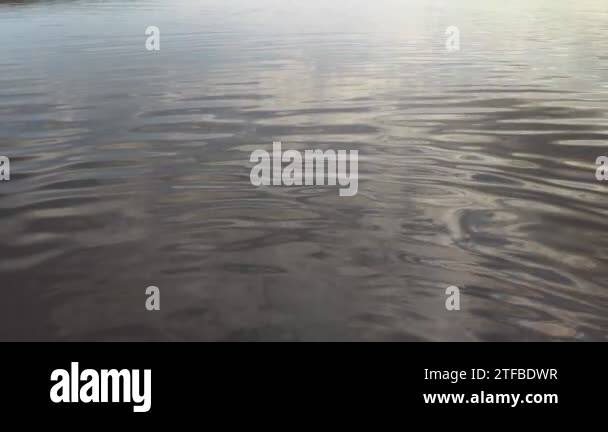 glare and reflections on the water. the sky is reflected in the water ...