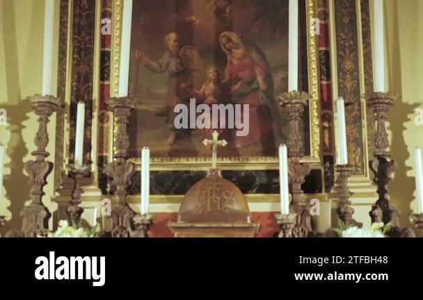 sequence on young woman kneeling down in a christian church: praying ...