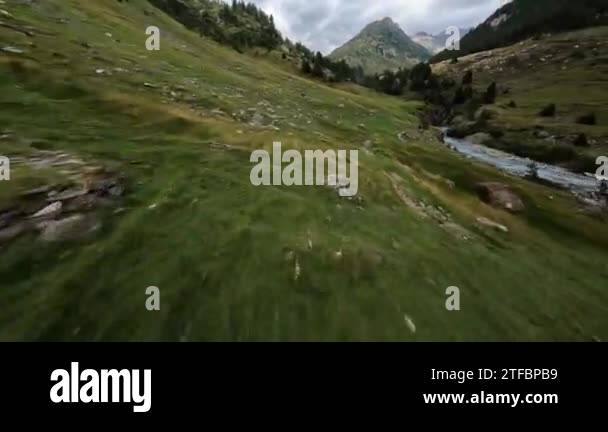 Switzerland alp alpine drone aerial glide fly through and over river ...