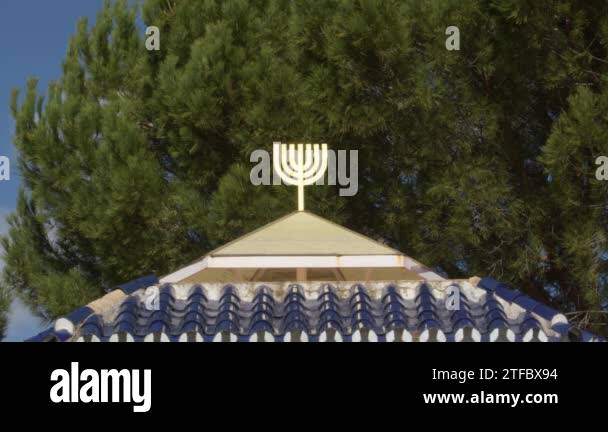 Menorah symbol in the roof of a place in a jewish cemetery Stock Video ...
