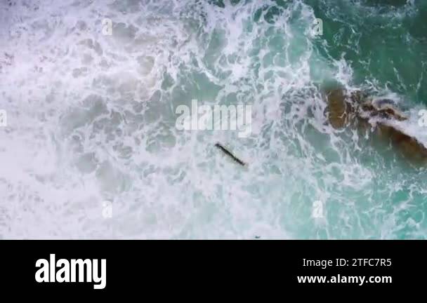 4K Aerial drone top down view bird eye view of sea blue waves break on ...
