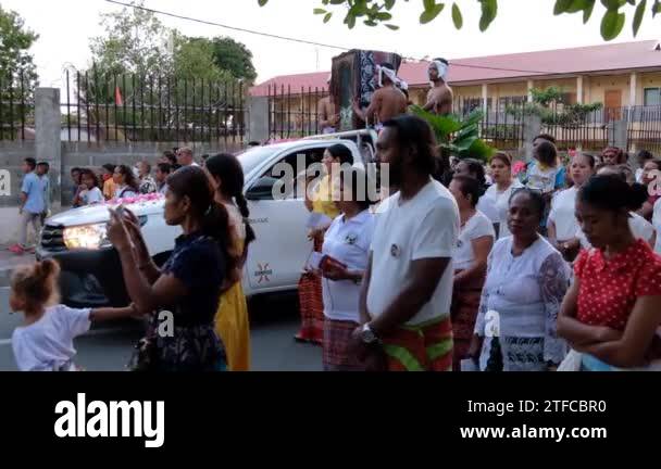 A religion parade and crowds of Timorese people on the streets of Dili ...