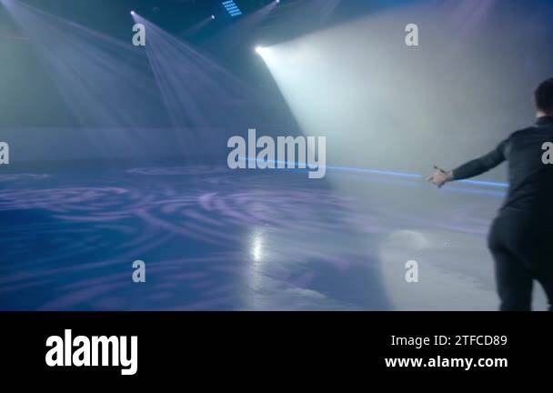 Pair of figure skaters, first man and then woman, appear in front of ...
