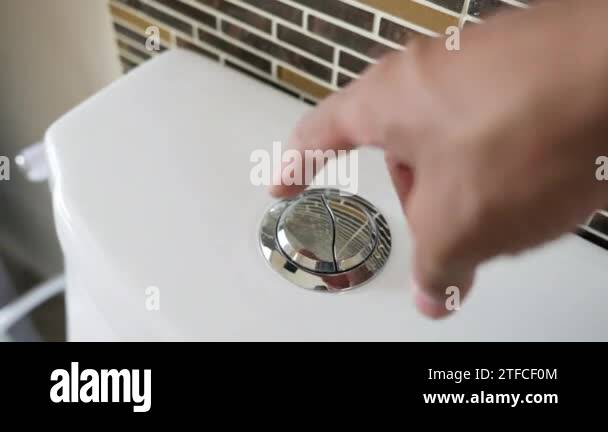 Hand press and flush toilet water to cleaning, The man finger is ...