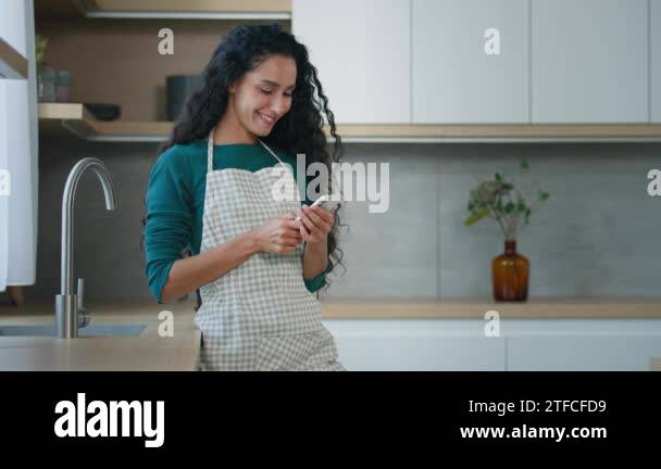 Glad smiling housewife arabian hispanic woman mother homeowner with ...