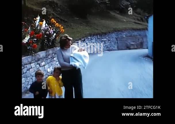 palermo, italy may 19 1970:woman with children playing with dog 70's Stock Video Footage - Alamy
