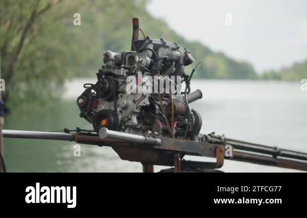 Car engine modified and installed on long-tail Thai wooden boat in ...