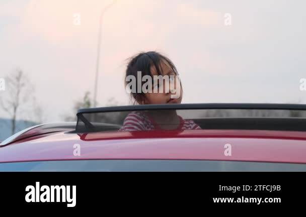 Happy family enjoying road trip on summer vacation. Happy Little girl ...