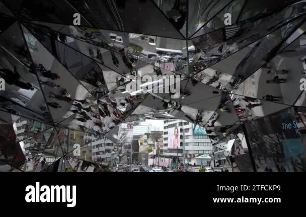 Tokyo, Japan-04 February, 2020: People reflections in the mirror of ...