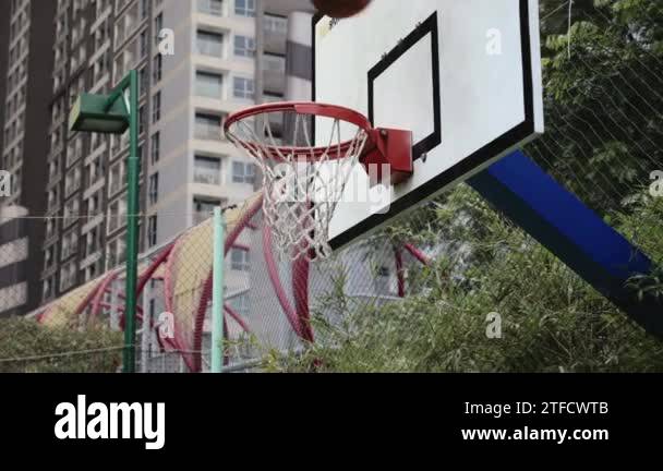 Sports throws into a basketball hoop from different angles throws ...