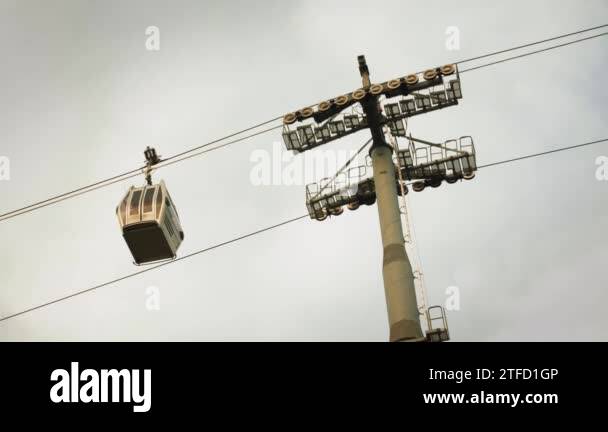 Rollers of cable car lift. Ski cabin lift gears. Wheels rotating cable ...
