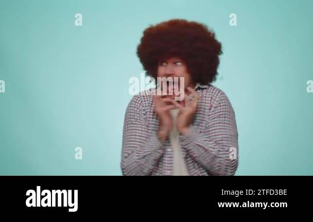Bearded adult man scared fearful, covering ears with hands, closing ...