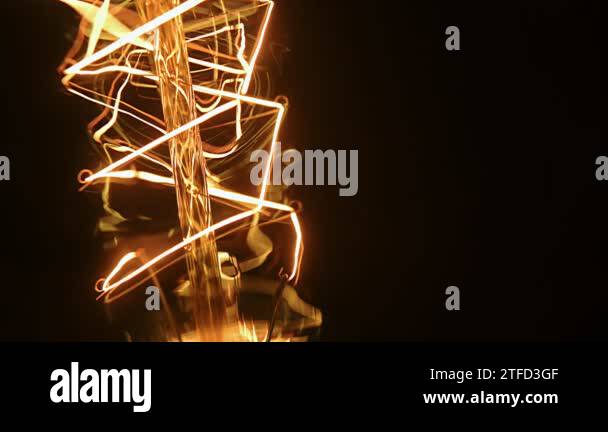 Edison light bulb slowly reveal in focus and details while flickering ...