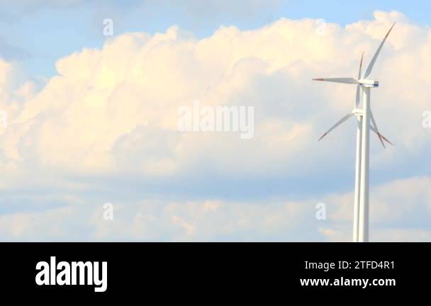 Wind turbines on cloudy sky background.Green energy. Wind generators ...