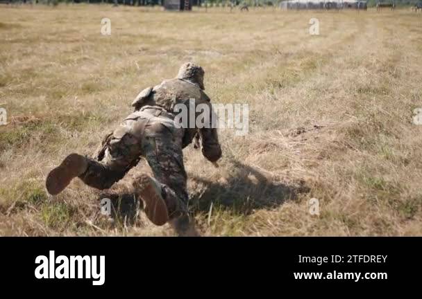 An attack on the enemy is underway by soldiers with weapons and ...