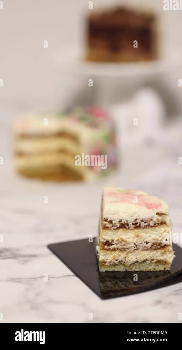 Slice of tiramisu bento cake. Presentation of cake in section. Sweet ...