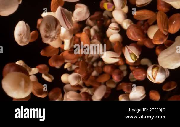 Super Slow Motion Closeup Shot of Falling Various Nuts Towards Camera ...
