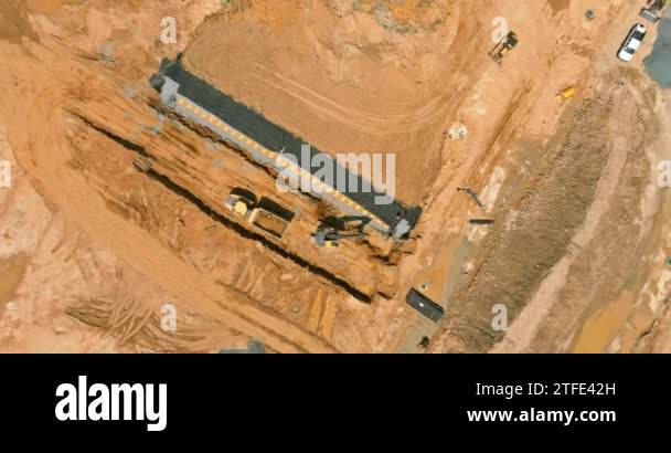Excavator is loading earth to the dump truck are heavy construction ...