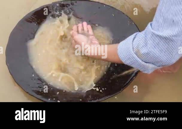 panning, in mining, simple method of separating particles of greater ...