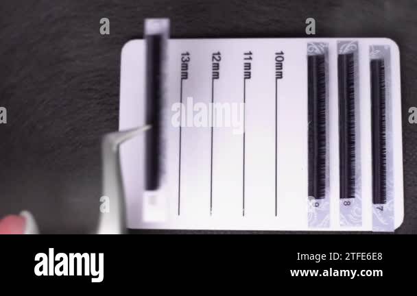 set of eyelash extensions of different lengths and volumes on a white ...