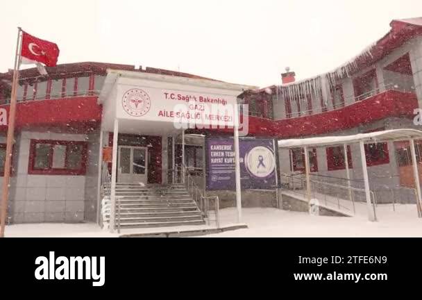 Erzurum in Turkey during a snow storm. snow falling on the family ...