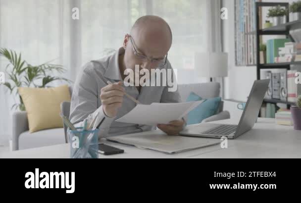 Checking paperwork Stock Videos & Footage - HD and 4K Video Clips - Alamy
