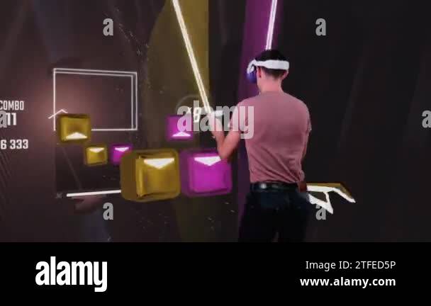 Man in a virtual reality headset plays an action video game in ...