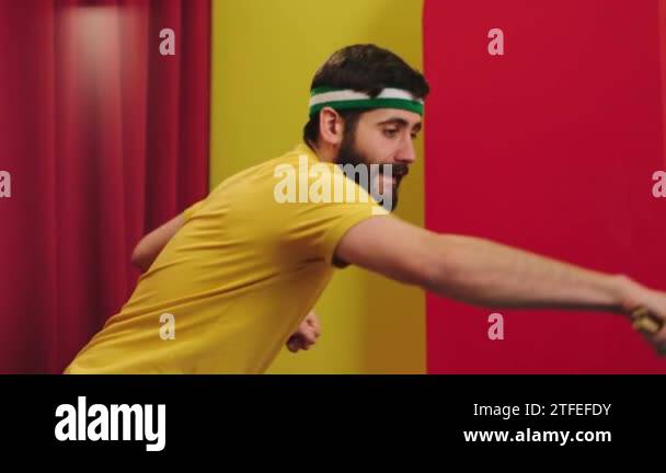 Excited ping pong players hitting the balls and catch very hard he play ...