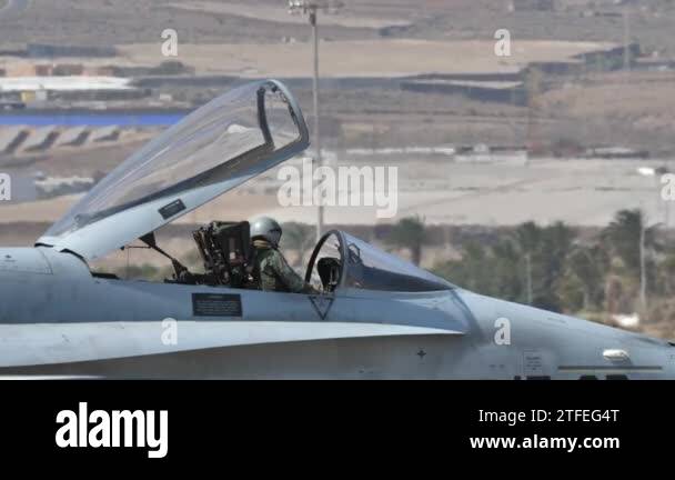 Cockpit of combat fighter jet with military pilot inside preparing to ...