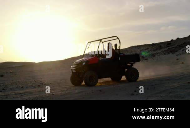 Tracking shot of buggy car moving through an african desert.. Tracking ...