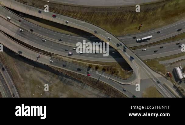 Top down footage of busy highway interchange. Multilane and multilevel ...