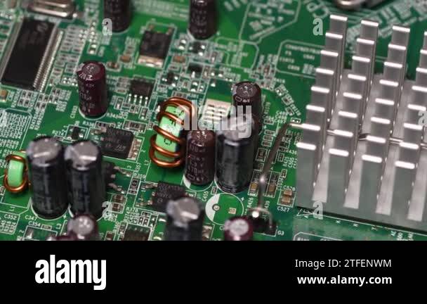Rotating printed circuit board with microprocessors and capacitors ...