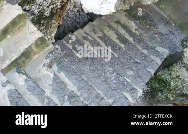 Stairs with dropping water leading to Blue Point Suluban Beach, Bali ...