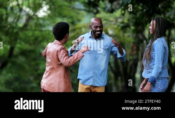 Three people celebrating success uniting group. African ethnicity Stock ...