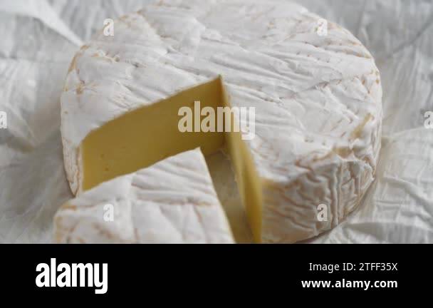 Rotating Camembert cream cheese, close-up, dairy product concept ...
