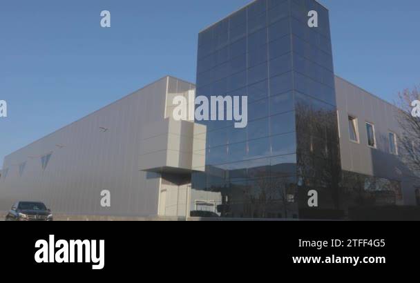 Exterior of a modern factory. Front door to a modern building. Exterior ...