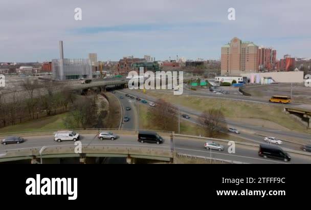 Busy roads in city. Forwards fly above multilevel interchange. Queue of ...