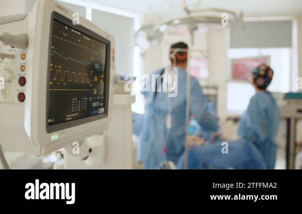 Modern medical operation room with monitor. Graphic lines on the screen ...
