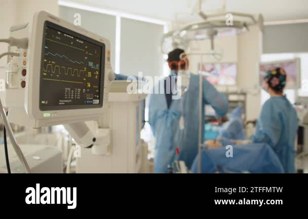 Monitors in intensive care unit. Heart beat of a patient on the screen ...